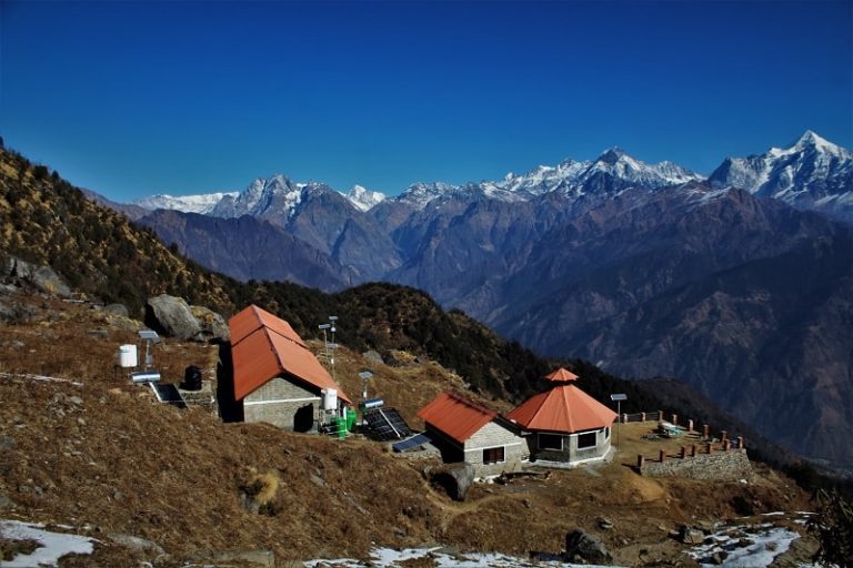 Hoisting the Indian flag at Zero Point on Khaliya top trek - Munsiyari