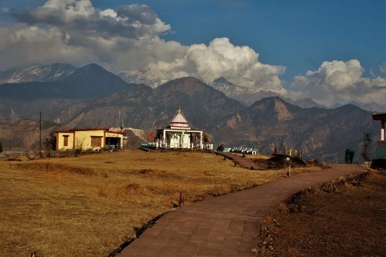 Hoisting the Indian flag at Zero Point on Khaliya top trek - Munsiyari