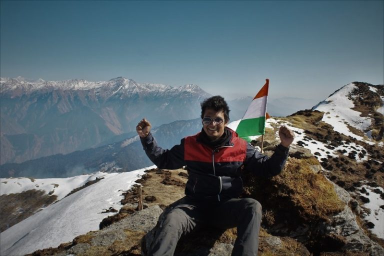 Hoisting the Indian flag at Zero Point on Khaliya top trek - Munsiyari